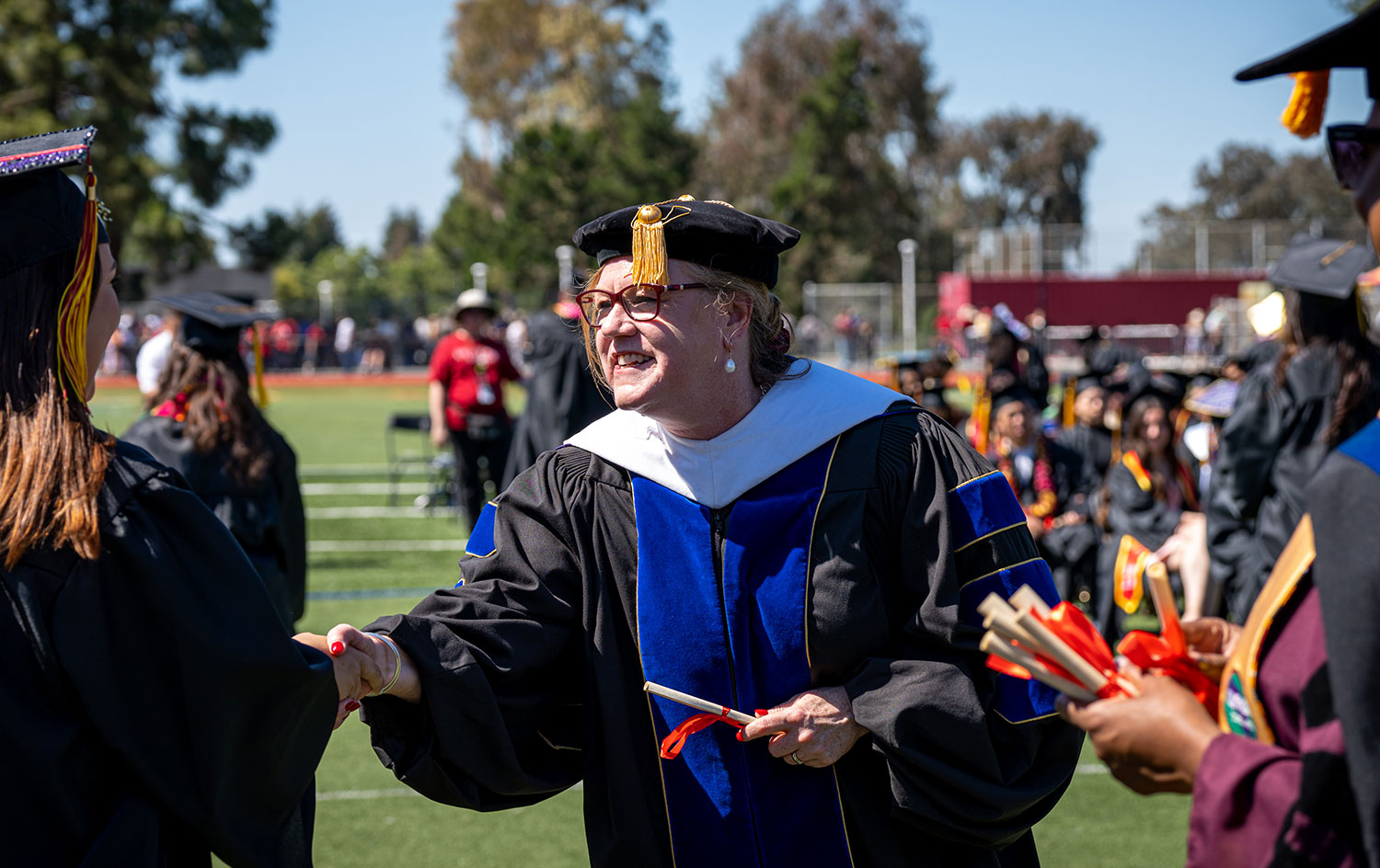 Pamala Ralston with graduates